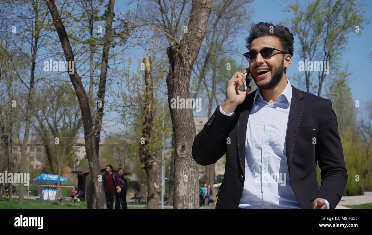 Cheerful arab man talking online hi-res stock photography and images ...