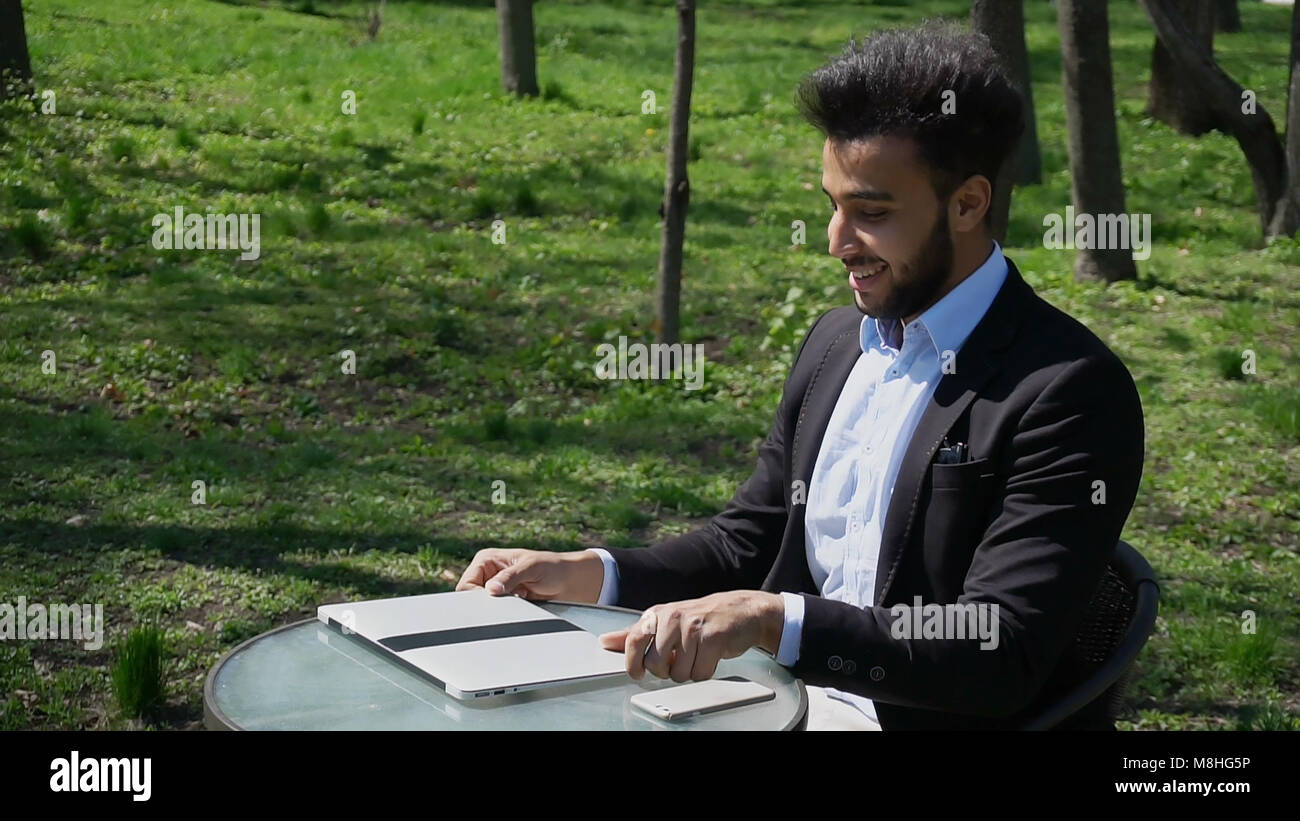 Journalist finished work in park Stock Photo - Alamy