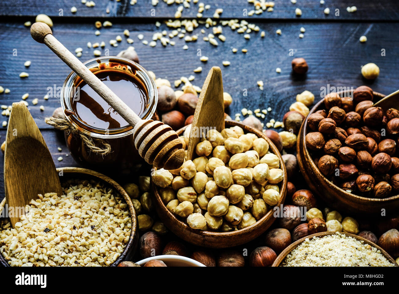 Different types of hazelnuts on dark wooden background with copyspace ...