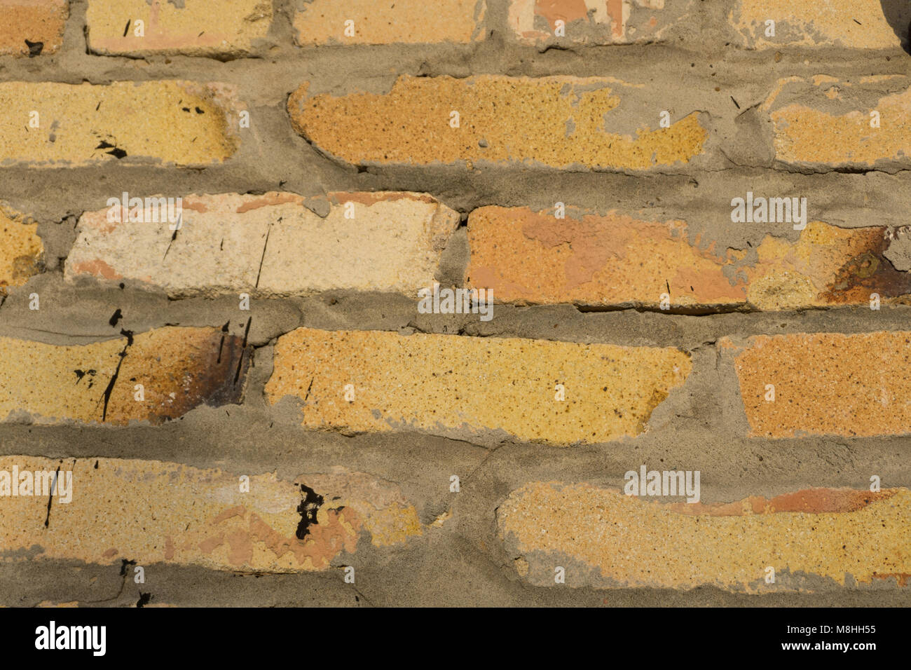 Wall of new refractory bricks closeup yellow Stock Photo - Alamy