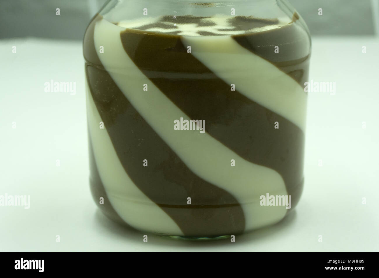 Duo colored chocolate paste in a jar Stock Photo - Alamy