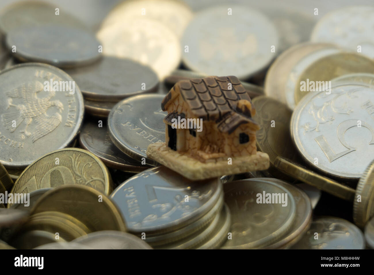 Little house toy and money in woman's hands Stock Photo - Alamy