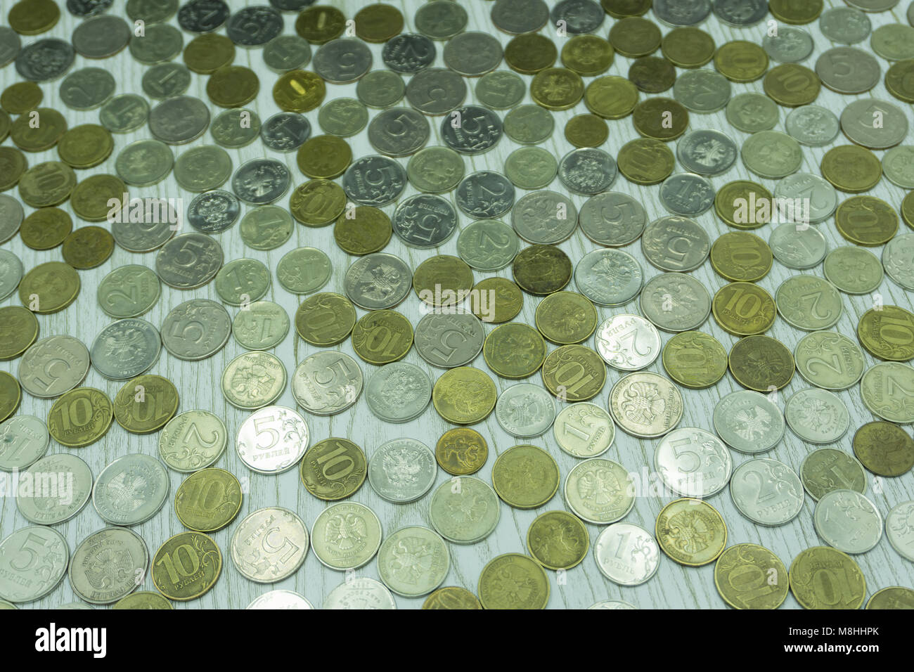 Pile of coins isolated on white. Top view Stock Photo - Alamy