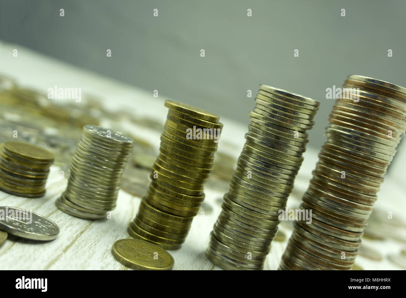 Coins lie on each other. To form the shape of a ladder Stock Photo - Alamy