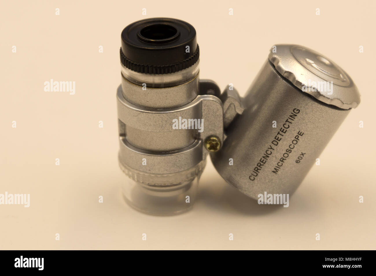 Microscope with mini book scratched shape sideview Stock Photo - Alamy