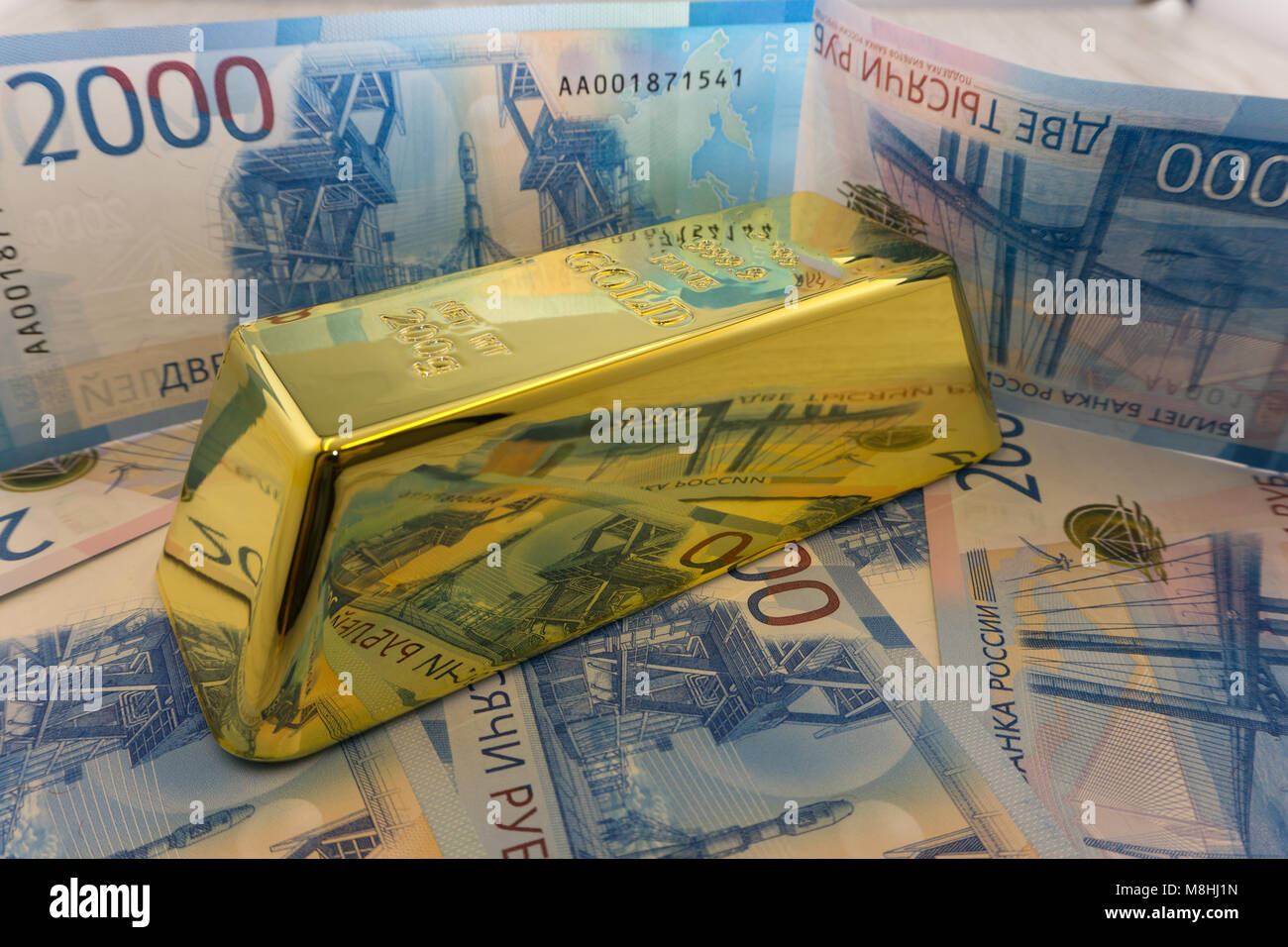 Gold bars on dollar banknotes, close up Stock Photo - Alamy