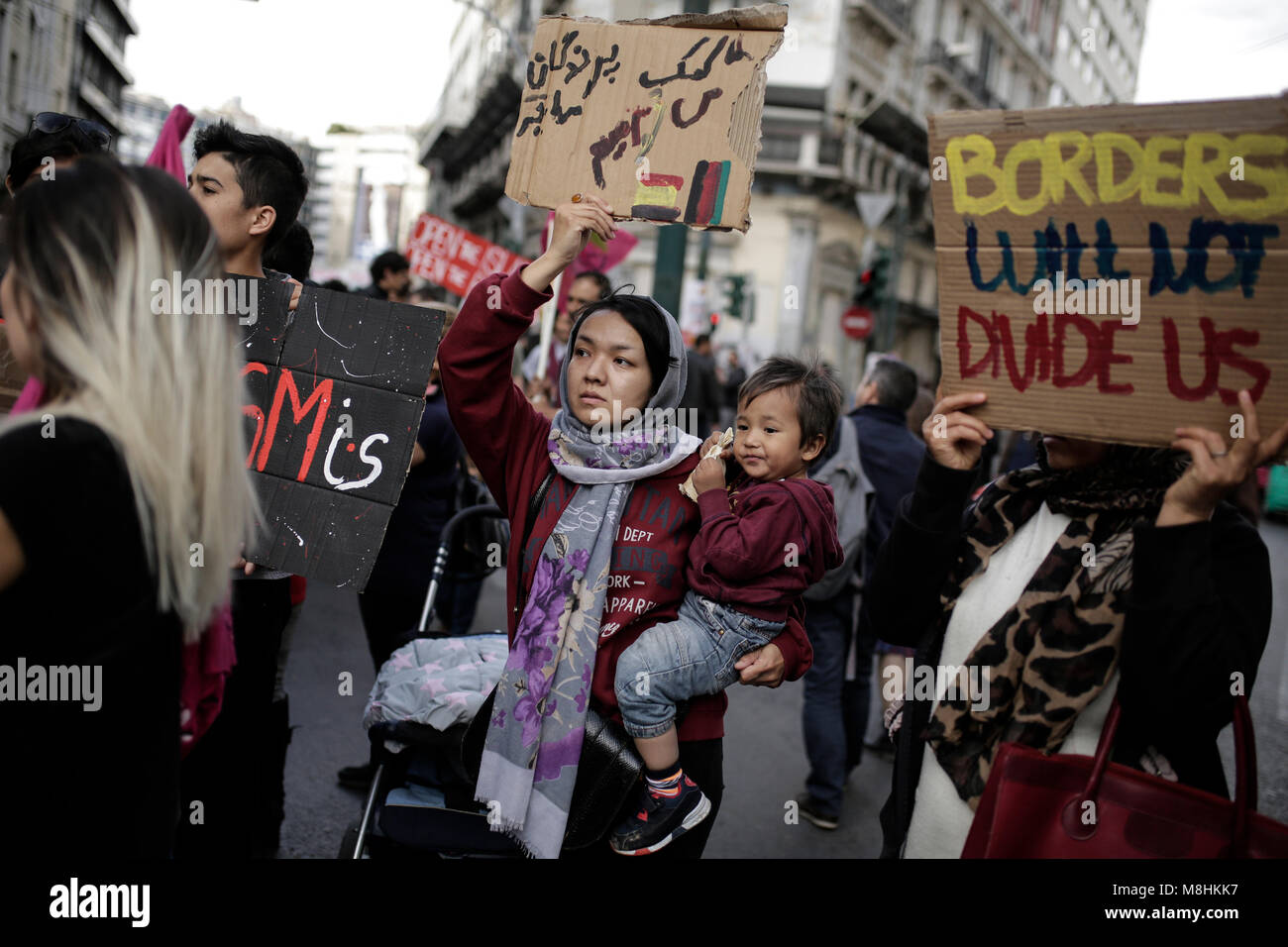 Woman holds against racism hi-res stock photography and images - Alamy