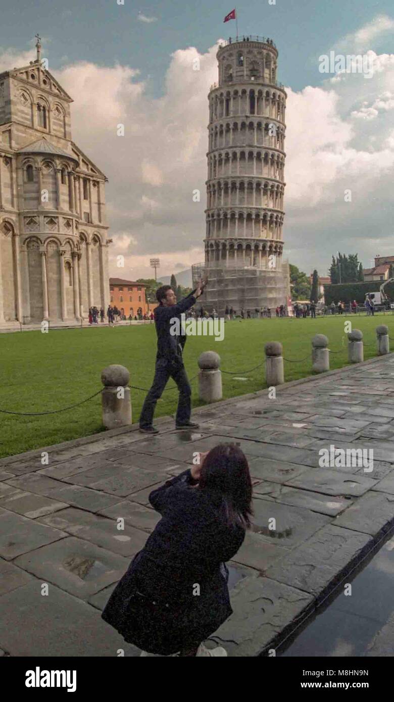 Pisa, Italy. 18th Oct, 2004. A tourist has his picture taken doing the ...
