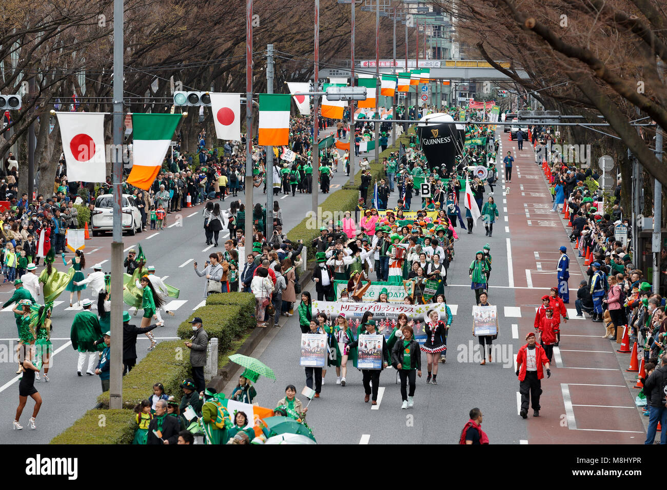 Tokyo, Japan. 18th March 2018. Participants dressing green march during ...