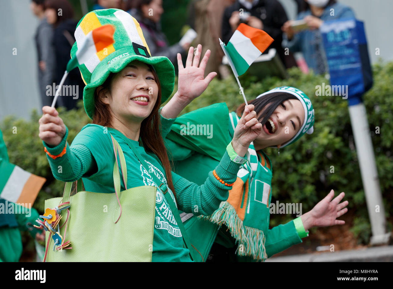 Tokyo, Japan. 18th March 2018. Participants dressing green march during ...