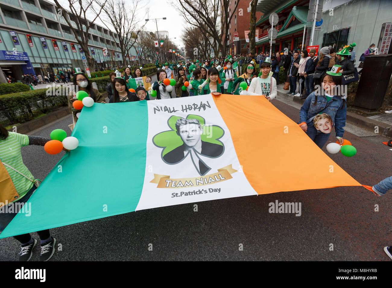 Tokyo, Japan. 18th March 2018. Participants dressing green march during ...