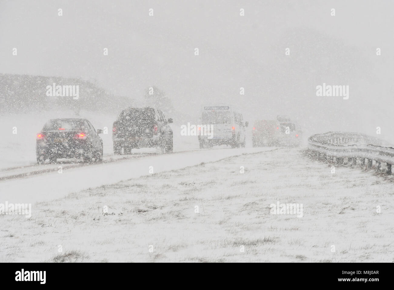 Long Bredy, Dorset, UK. 18th March 2018. UK Weather. Vehicles struggles ...