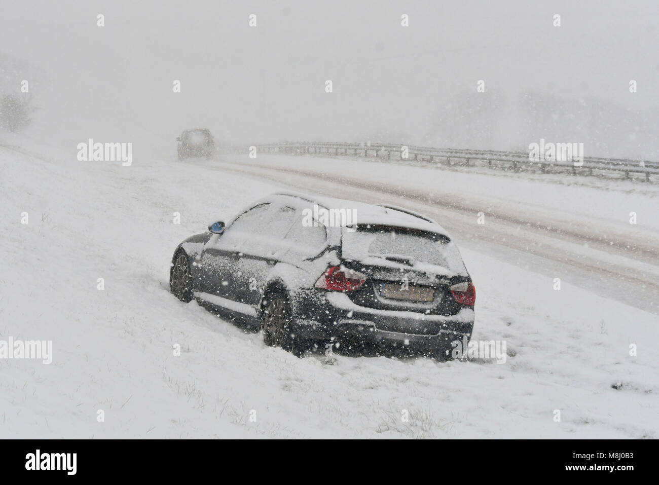 Long Bredy, Dorset, UK. 18th March 2018. UK Weather. An abandoned car ...