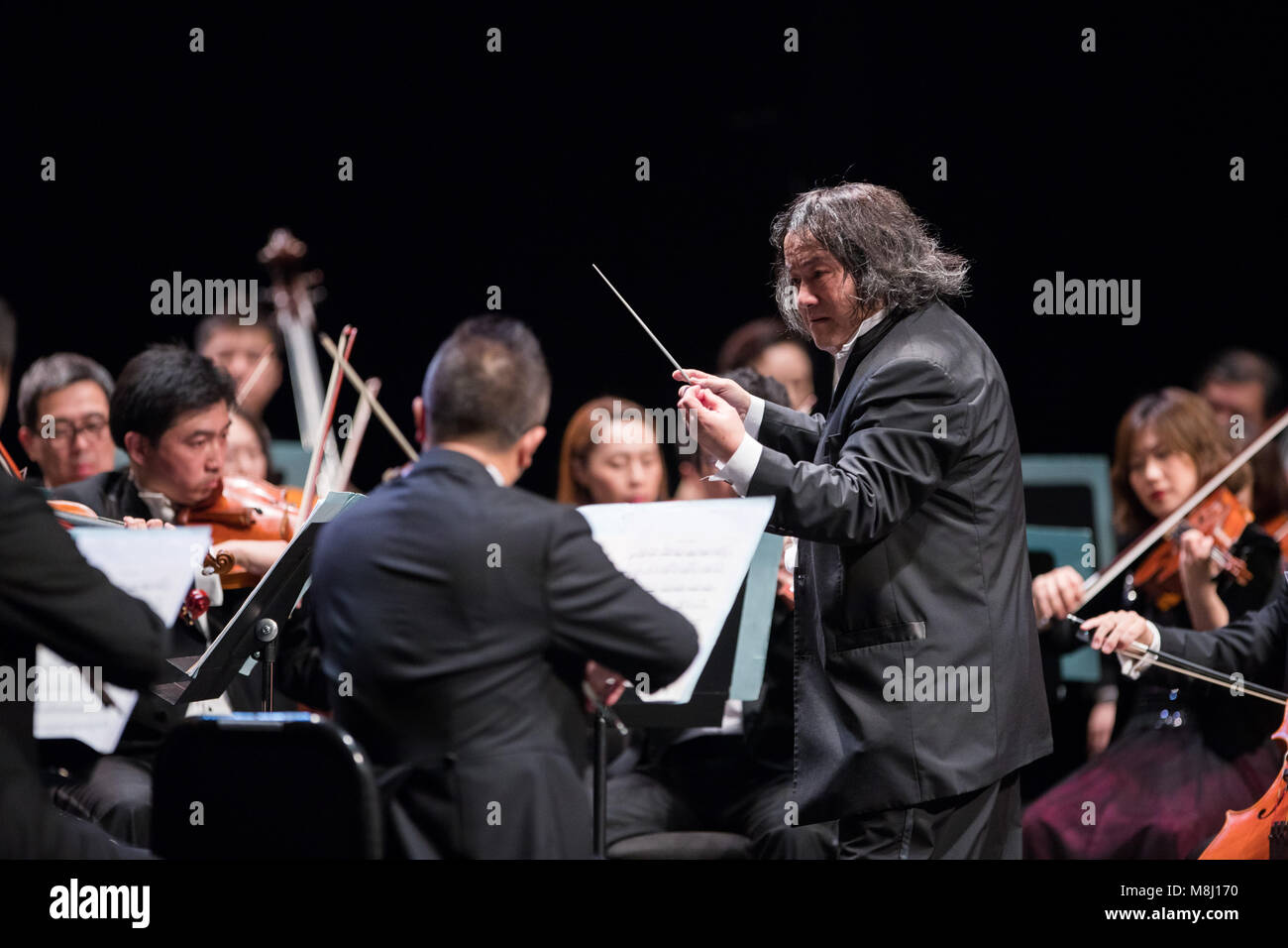 Kuala Lumpur, Malaysia. 17th Mar, 2018. Conductor Tang Muhai (R) and ...