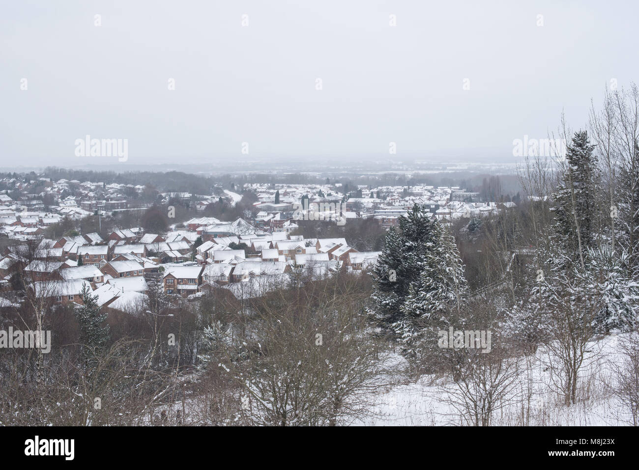 Snow covered roofs and trees across Telford in Shropshire, late morning ...