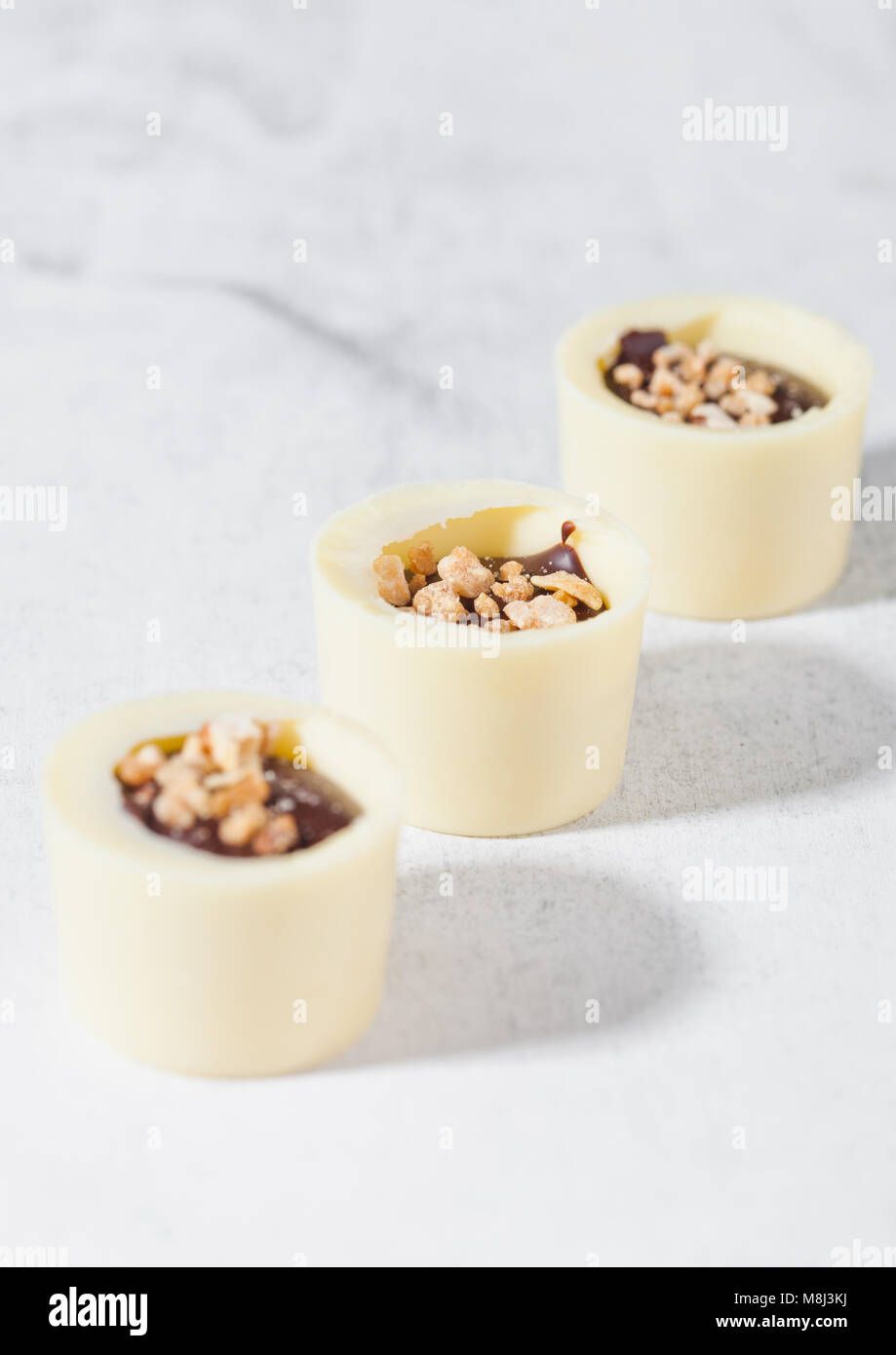 Assortment of luxury white chocolate candies variety on white ...