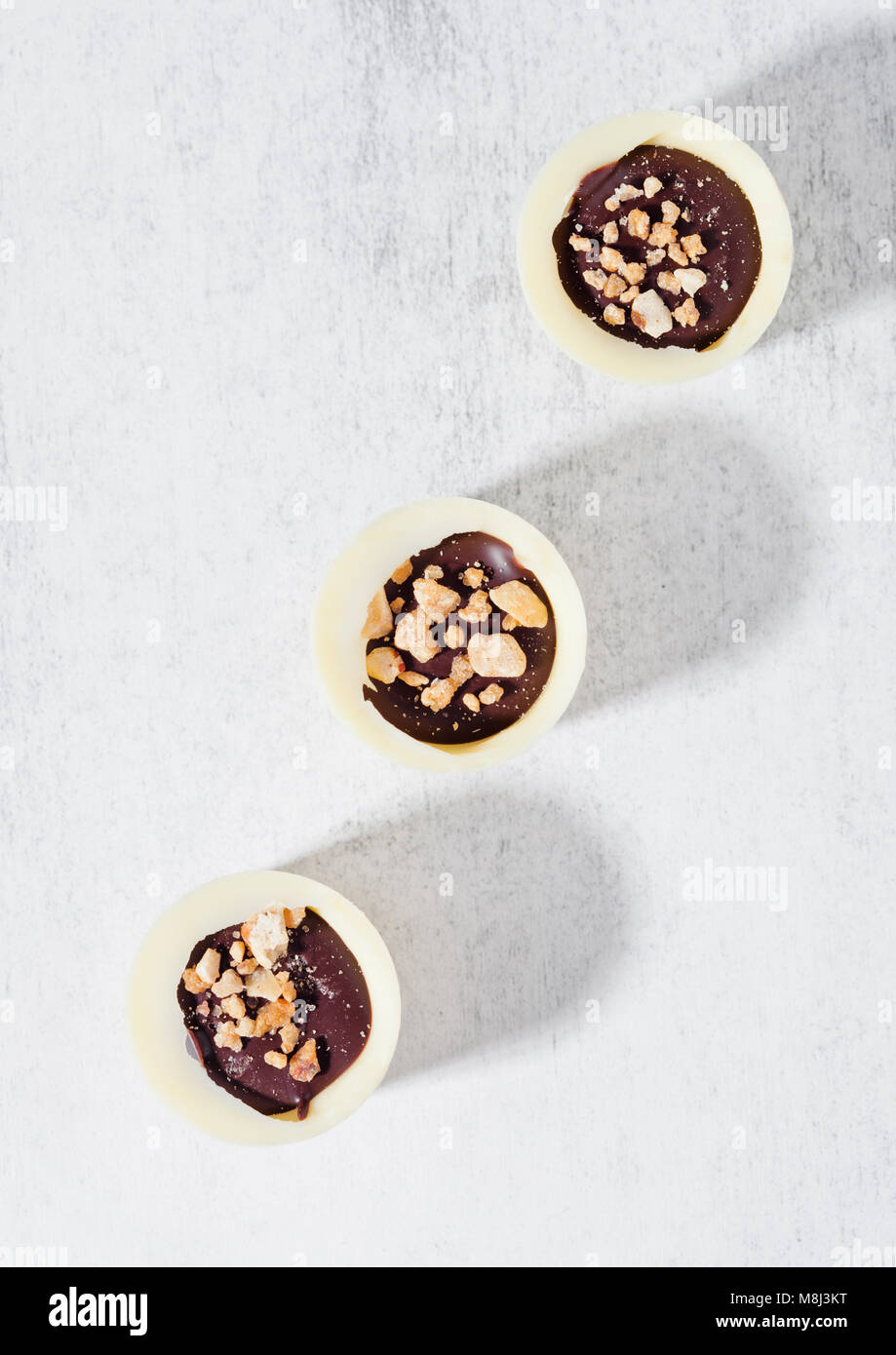 Assortment of luxury white chocolate candies variety on white ...