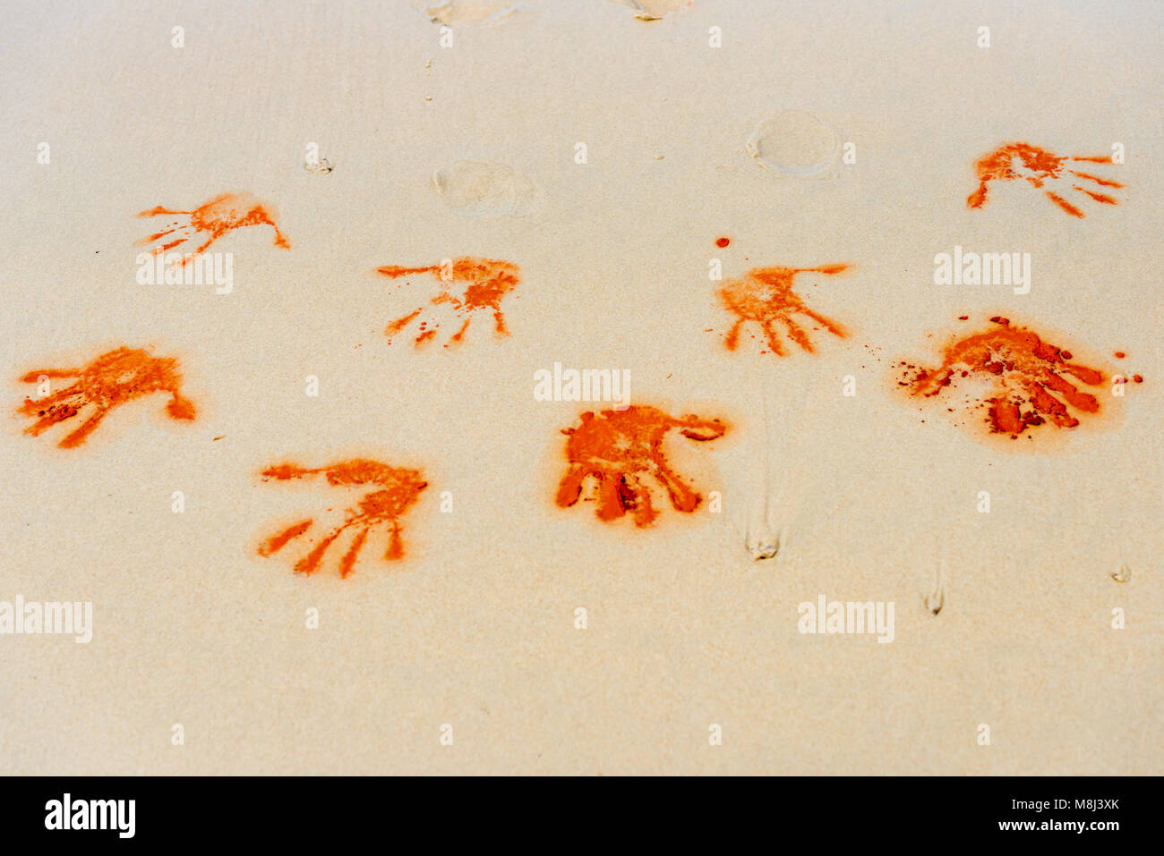 Red soil hand shape on sand in aboriginal art style, template for ...