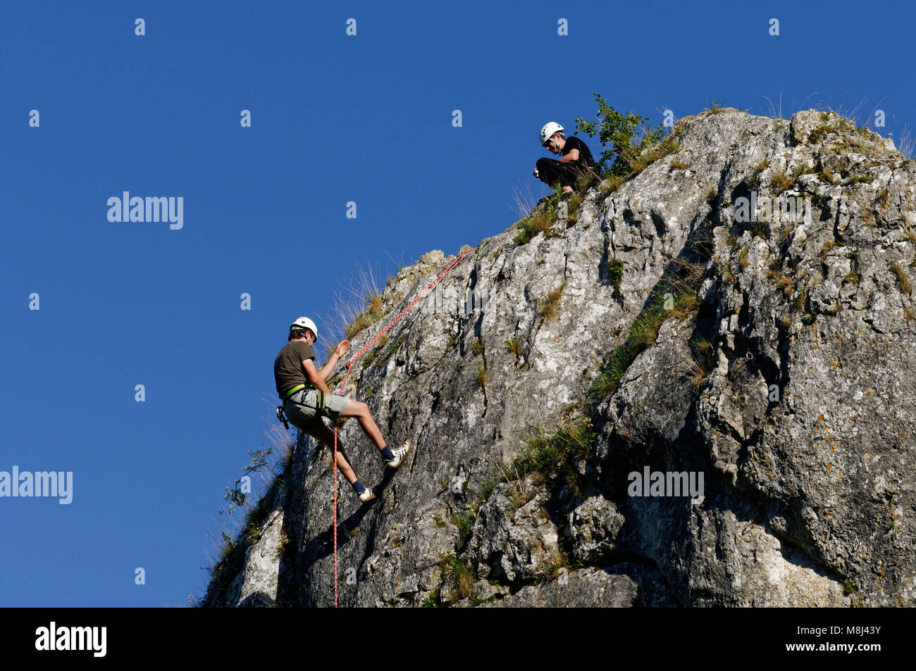 Two men climbing on a rock (limestone) in the Eselsburger Tal near ...