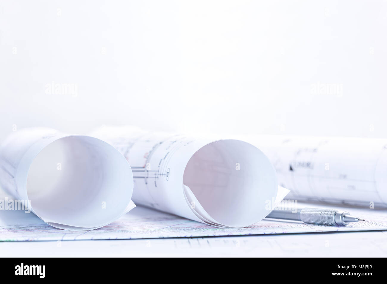 architect workplace with roll blueprints, project plans and pencil ...