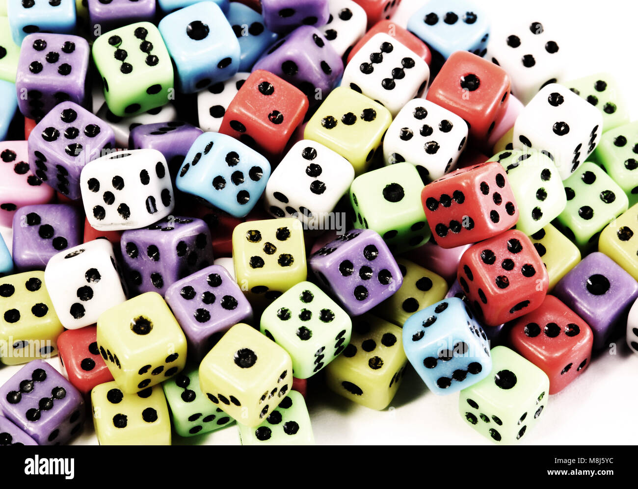 many dice to play with very bright effect Stock Photo - Alamy