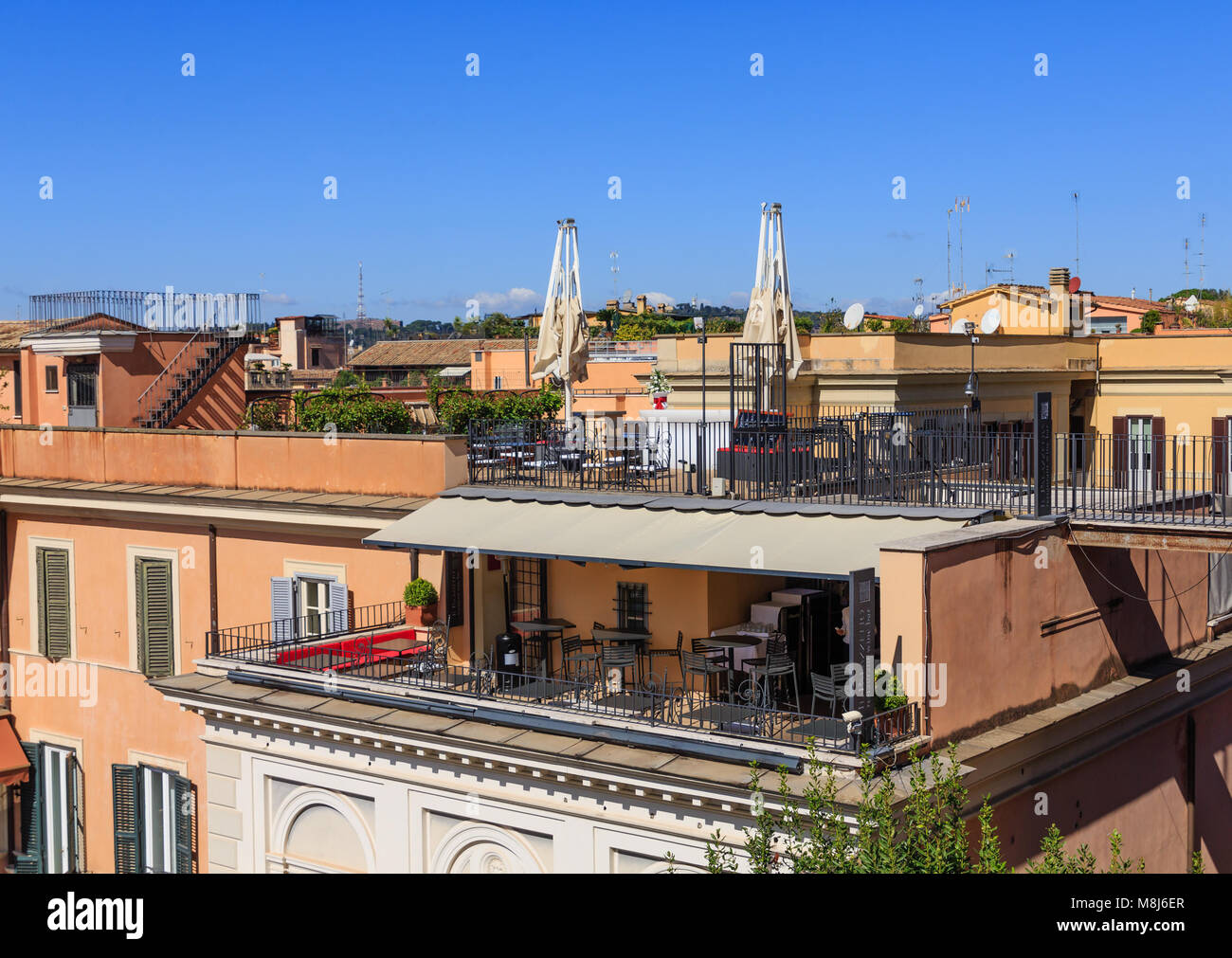 Rooftop Verandas on Roman Apartments under Blue Sky Stock Photo - Alamy