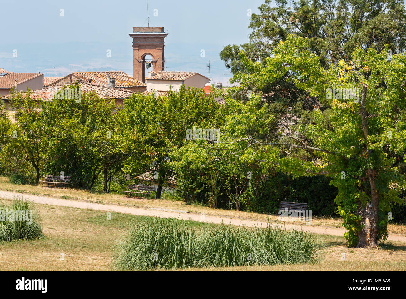 Summer ancient walled mountaintop town Volterra street scene, Pisa ...