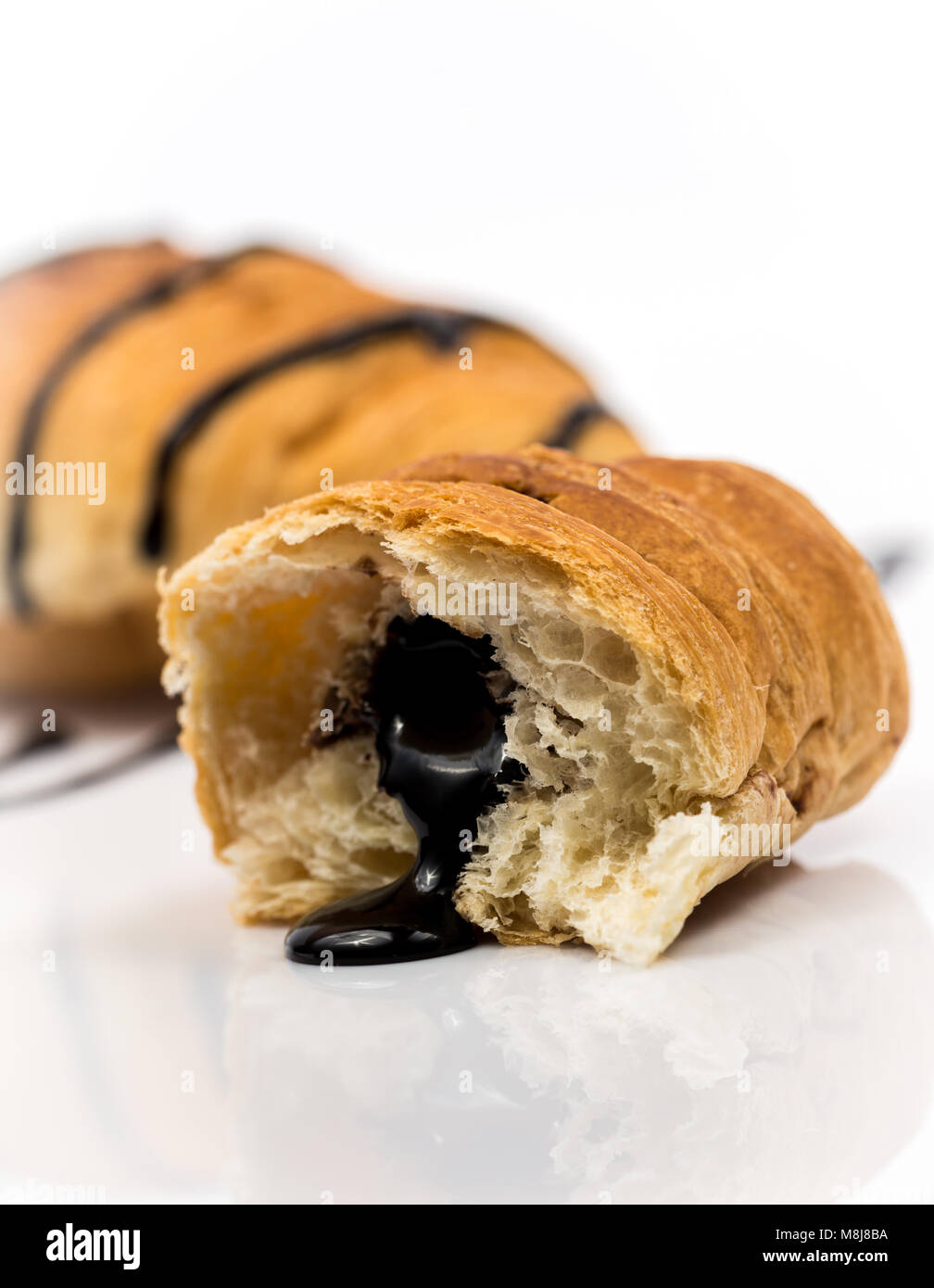 Traditional france breakfest croissant with chocolate isolated on white ...