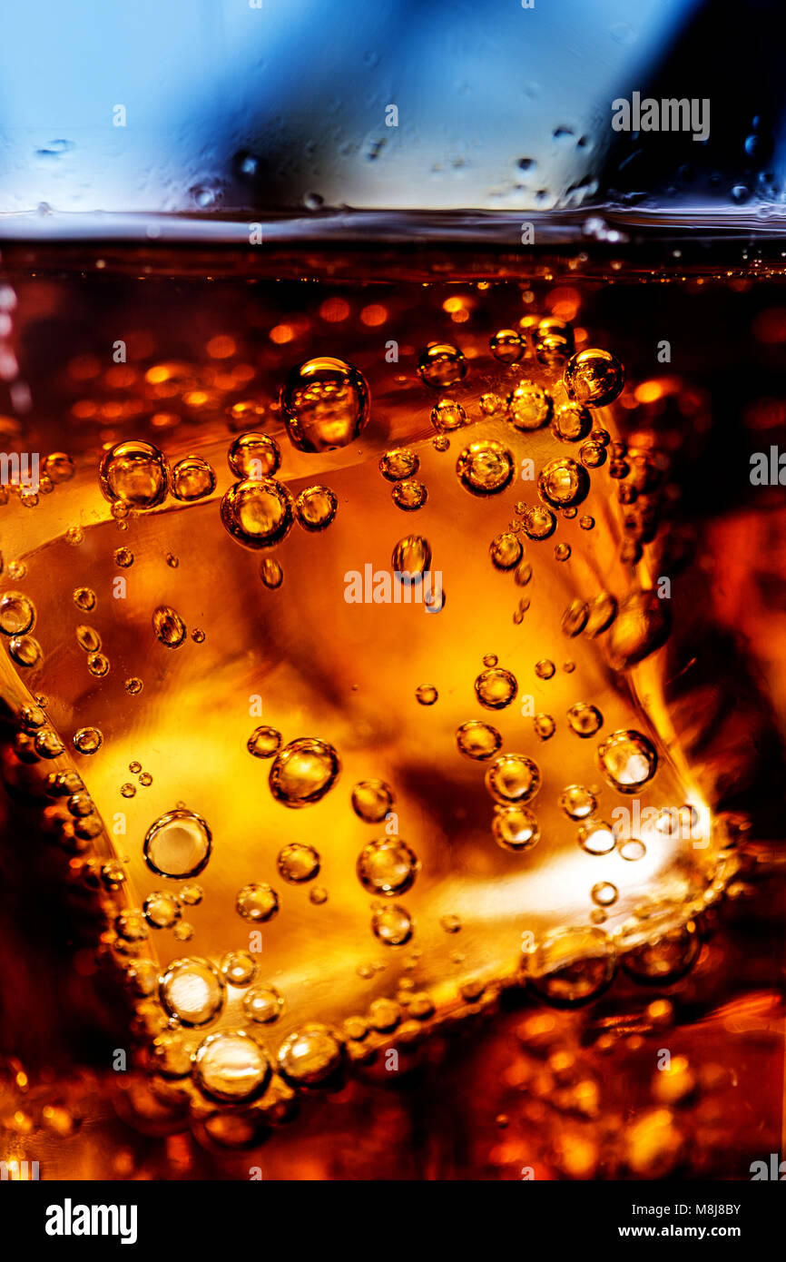 Cold cola drink with bubbles and ice cubes Stock Photo - Alamy