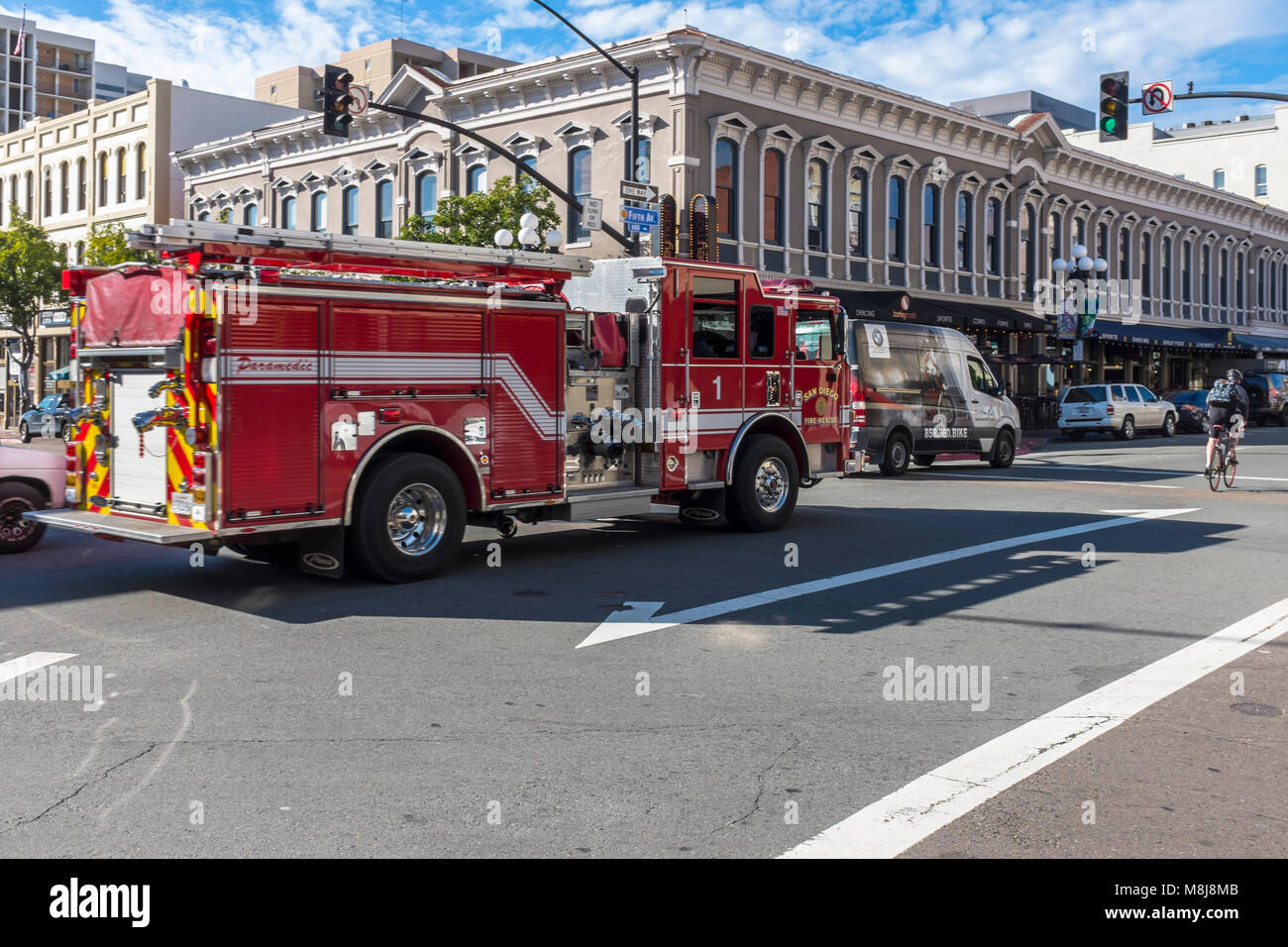 SAN DIEGO, CALIFORNIA, USA - Fire engine travelling down a street in ...