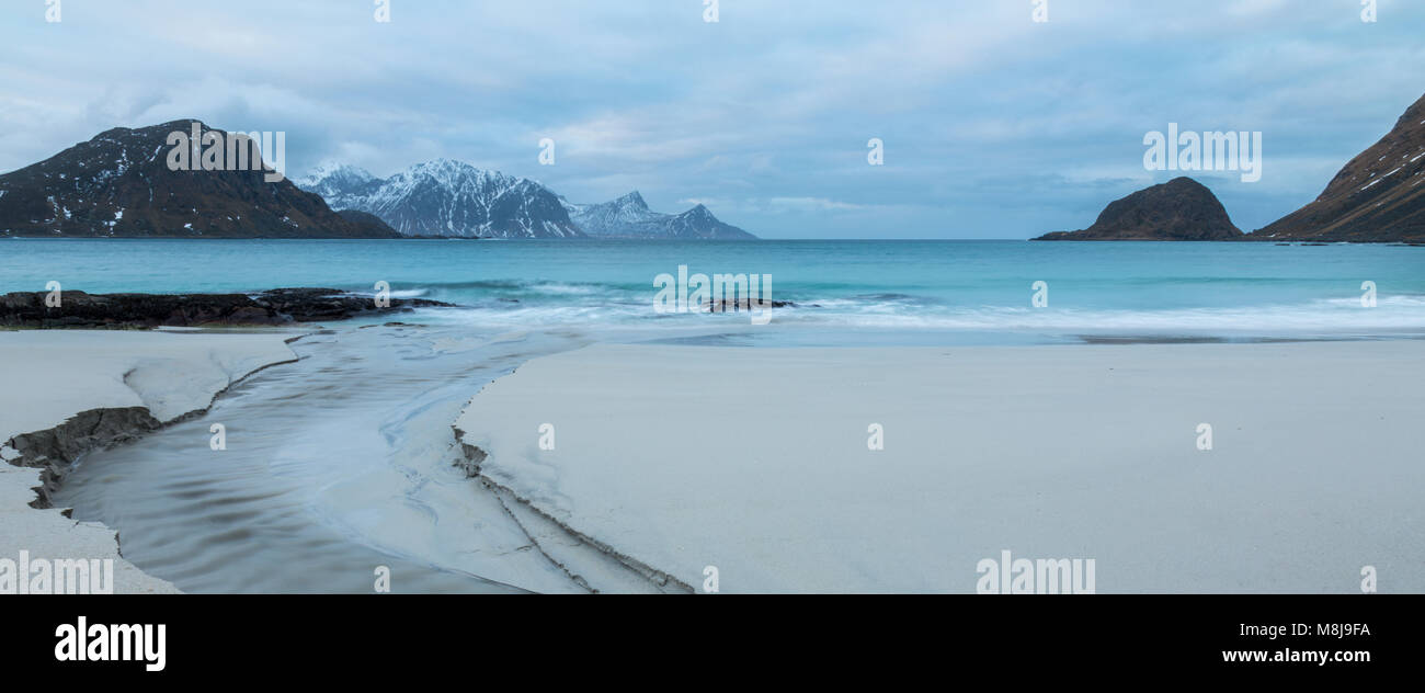 River flows into the ocean, Haukland Beach, Lofoten, Norway Stock Photo ...