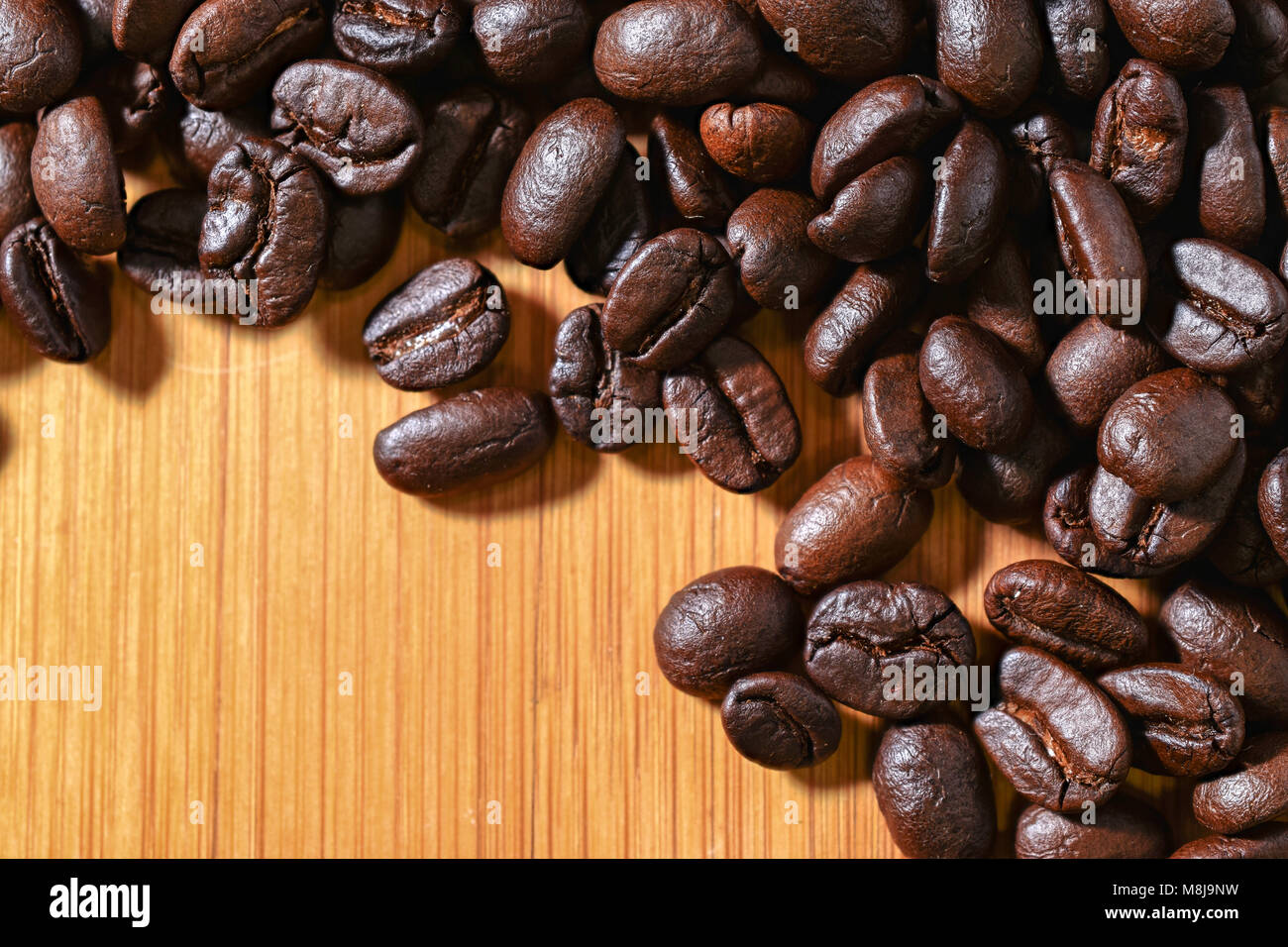 Closeup of coffee beans background ,coffee beans on wooden table Stock ...