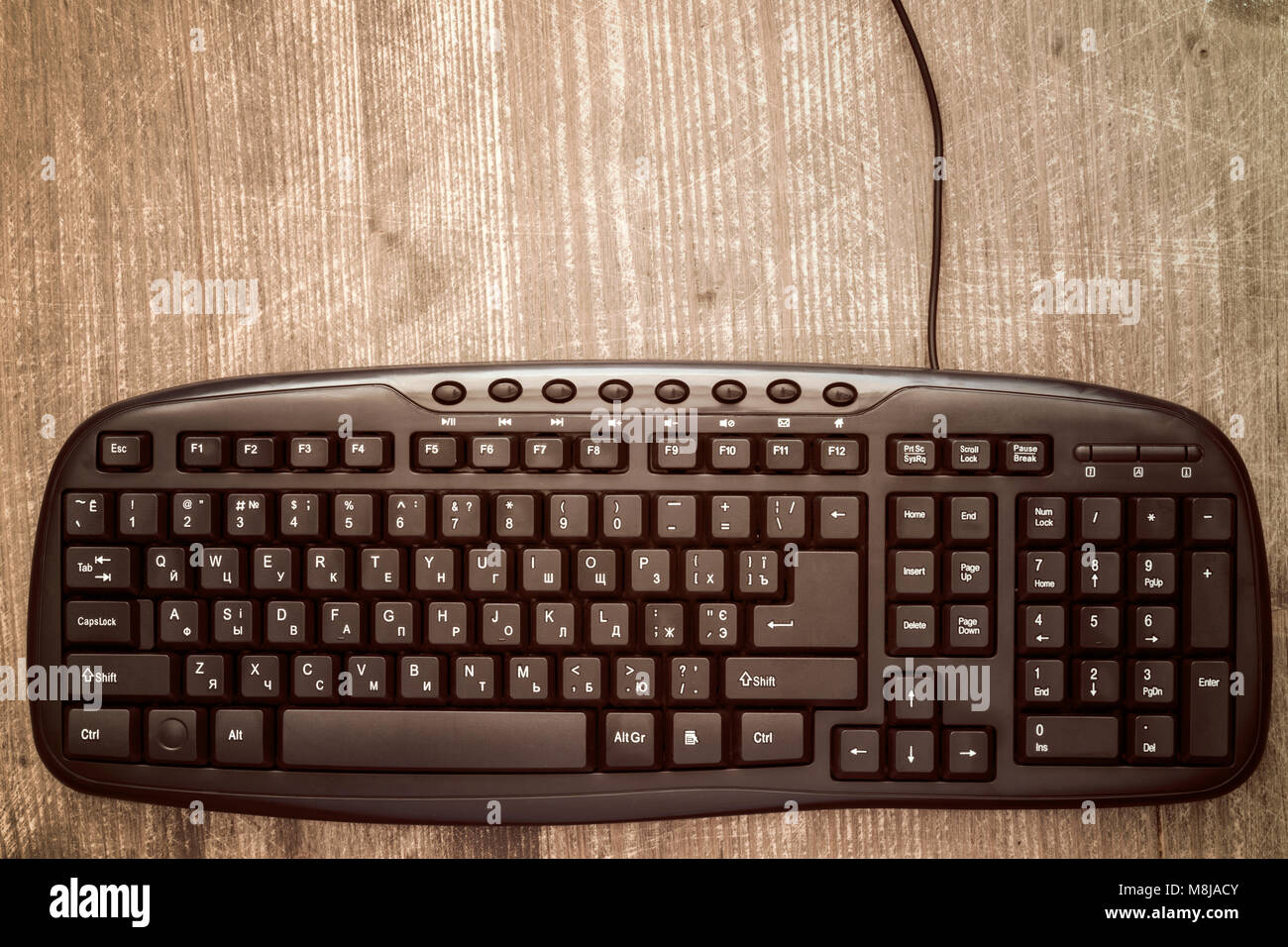 Black computer keyboard on the wooden desk Stock Photo - Alamy