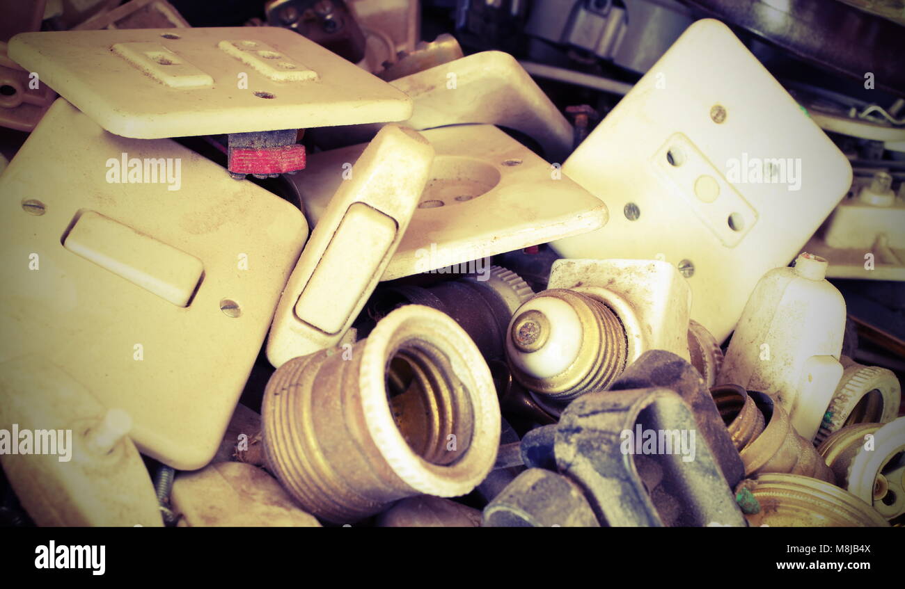 many ancient electric equipments with switches and sockets in the flea ...