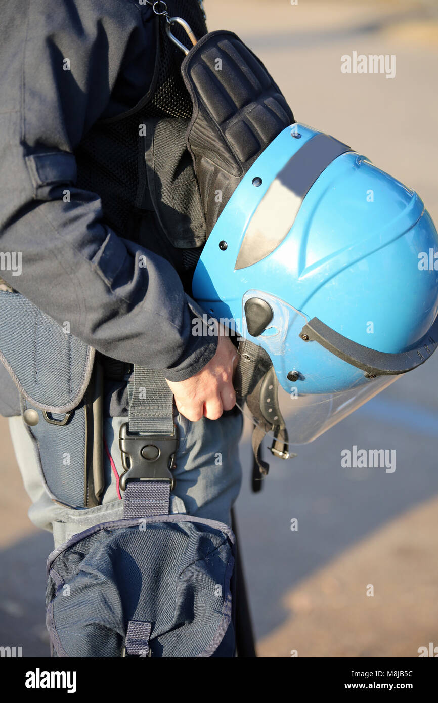blue helmet of a policeman riot cop during the uprising in the city ...