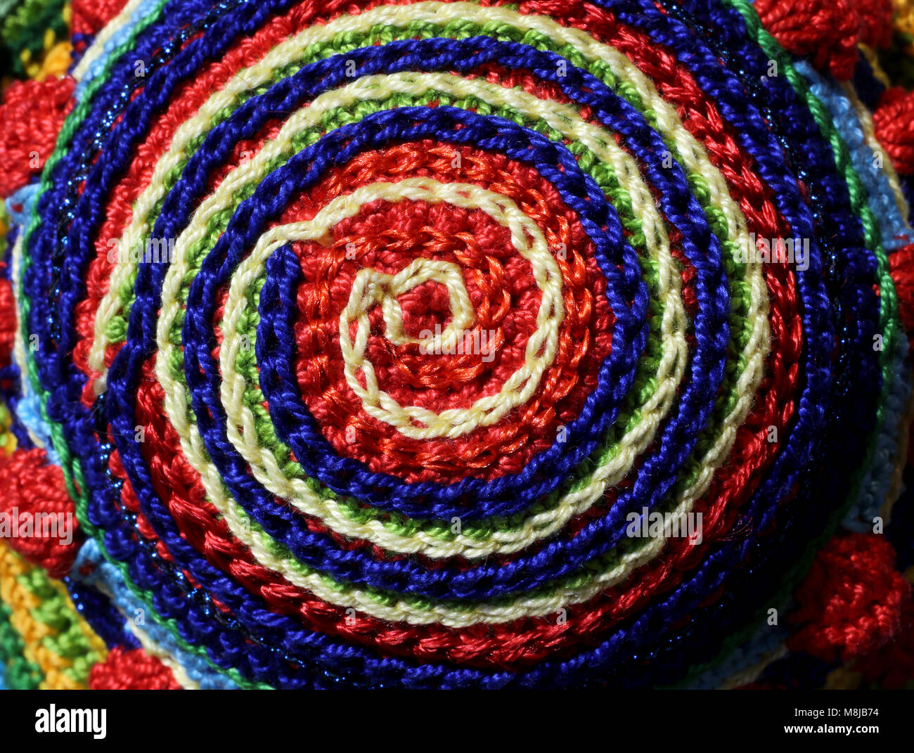 colored pinwheel with woven threads in the shape of a circle Stock ...