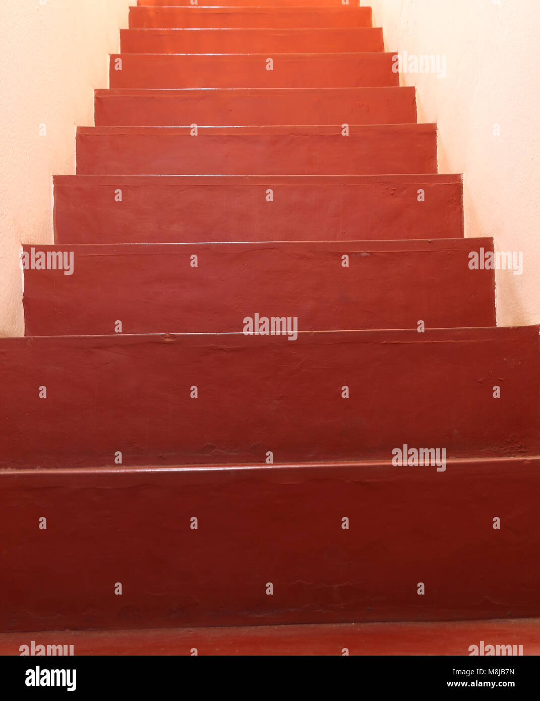 very long red staircase rising to infinity and beyond Stock Photo - Alamy