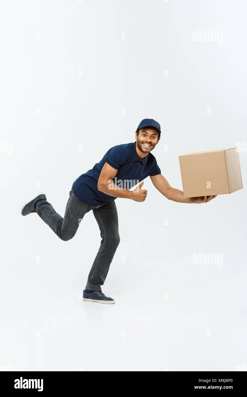 Delivery Concept - Handsome African American delivery man rush running ...