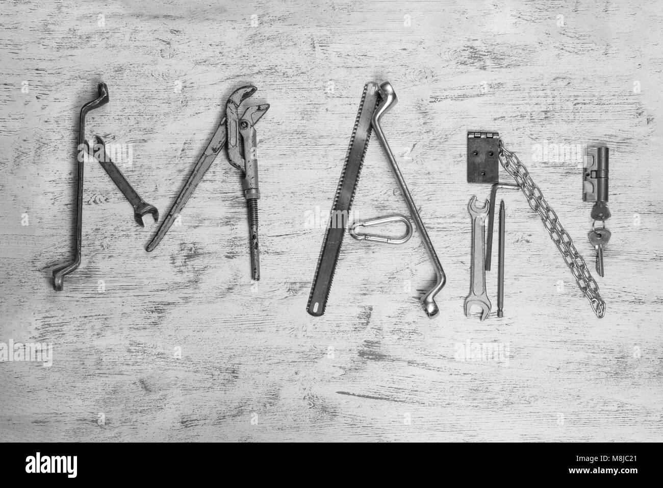 text MAN is written by work tools. The word MAN is made up of a work ...