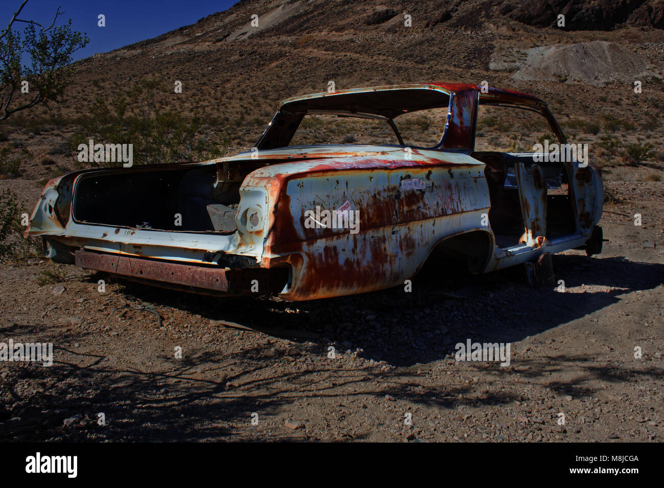 rusted out old car with red roof Stock Photo - Alamy