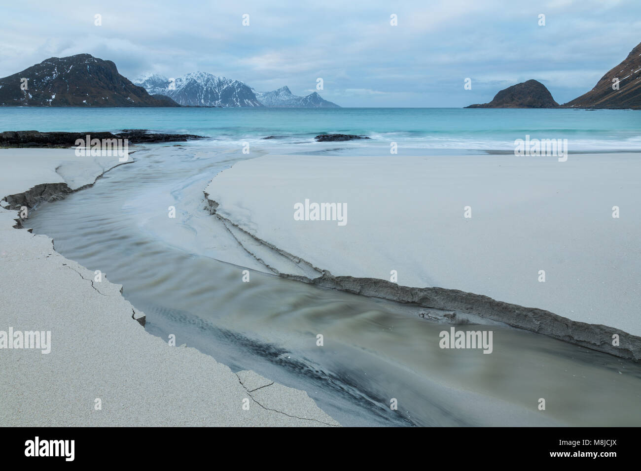 River flows into the ocean, Haukland Beach, Lofoten, Norway Stock Photo ...