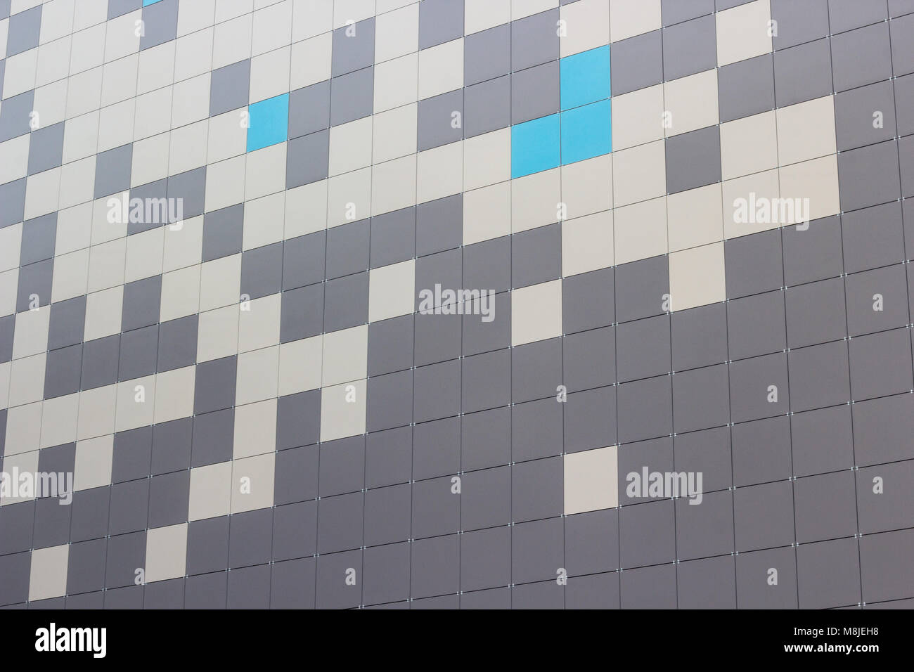 Brushed metal tiled panels at the wall Stock Photo - Alamy