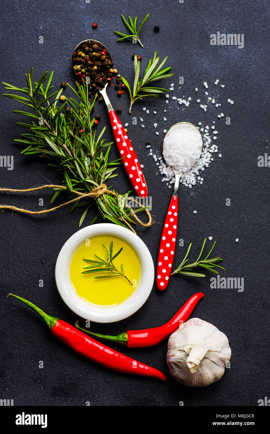 Organic food cooking concept with fresh spices on dark background with ...