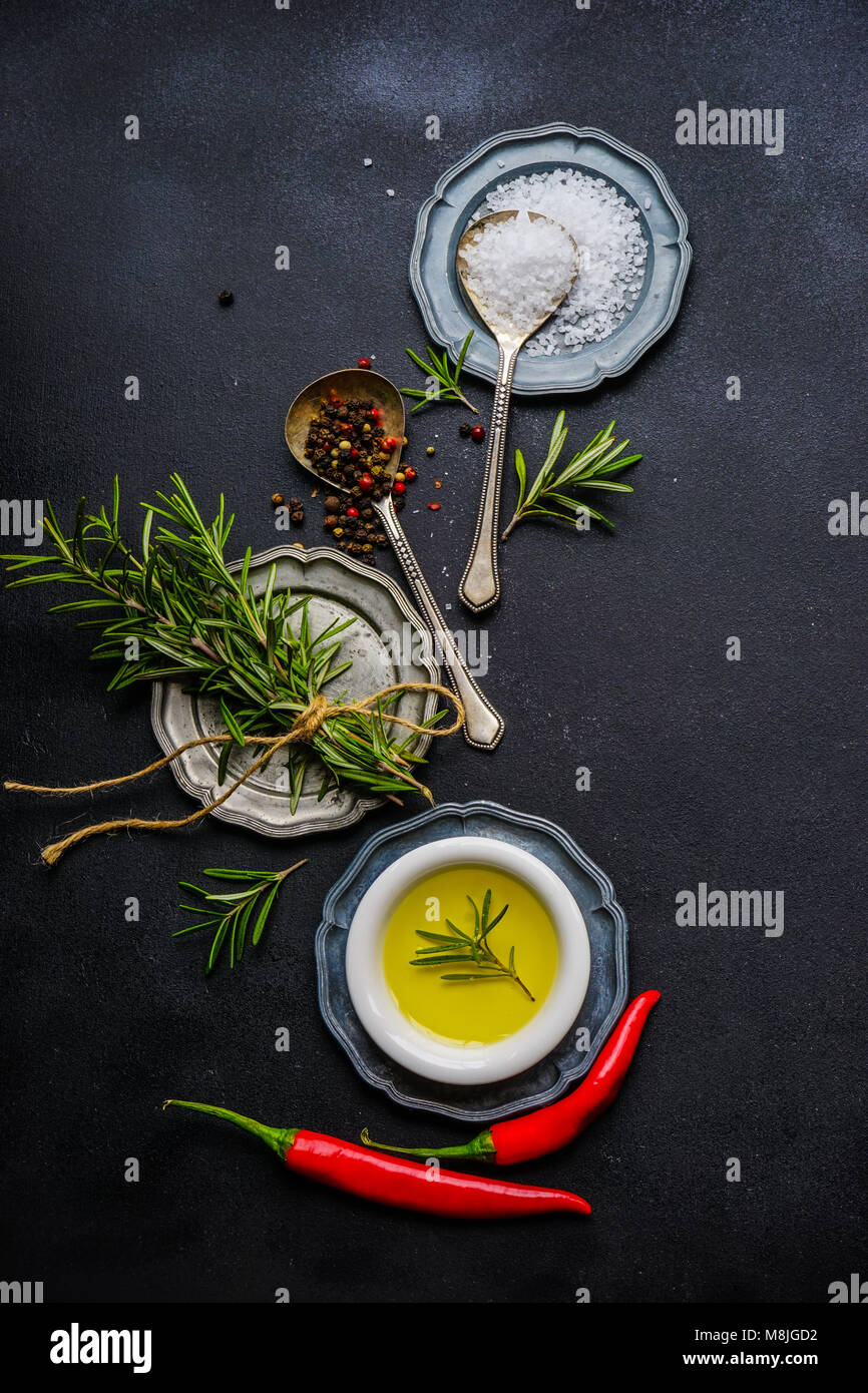 Organic food cooking concept with fresh spices on dark background with ...