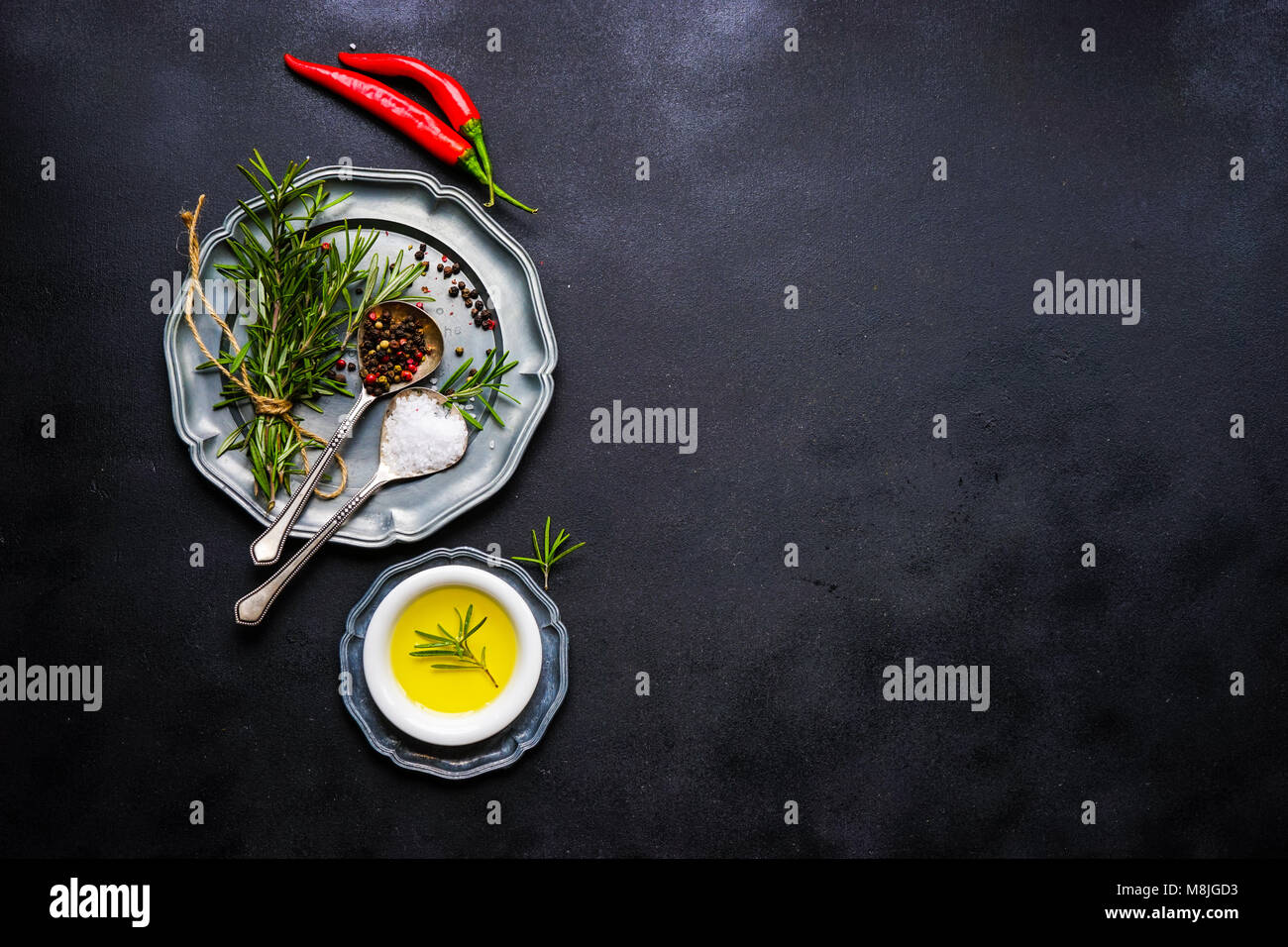 Organic food cooking concept with fresh spices on dark background with ...
