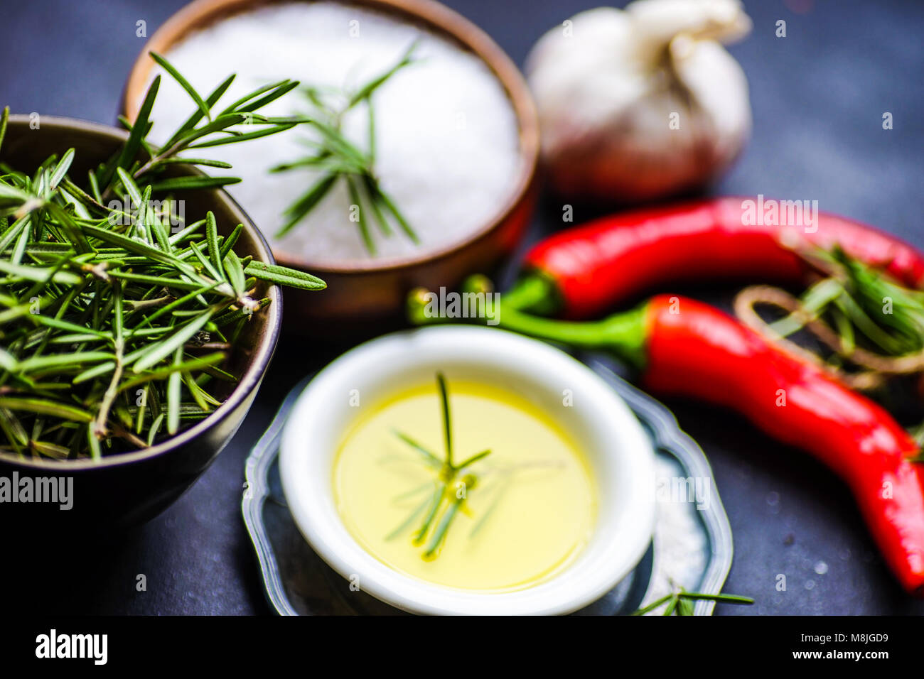 Organic food cooking concept with fresh spices on dark background with ...