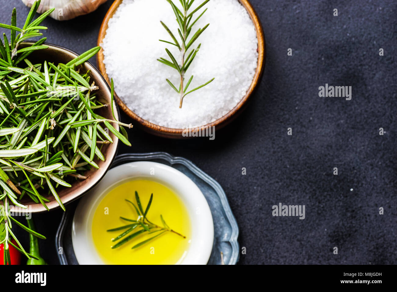 Organic food cooking concept with fresh spices on dark background with ...