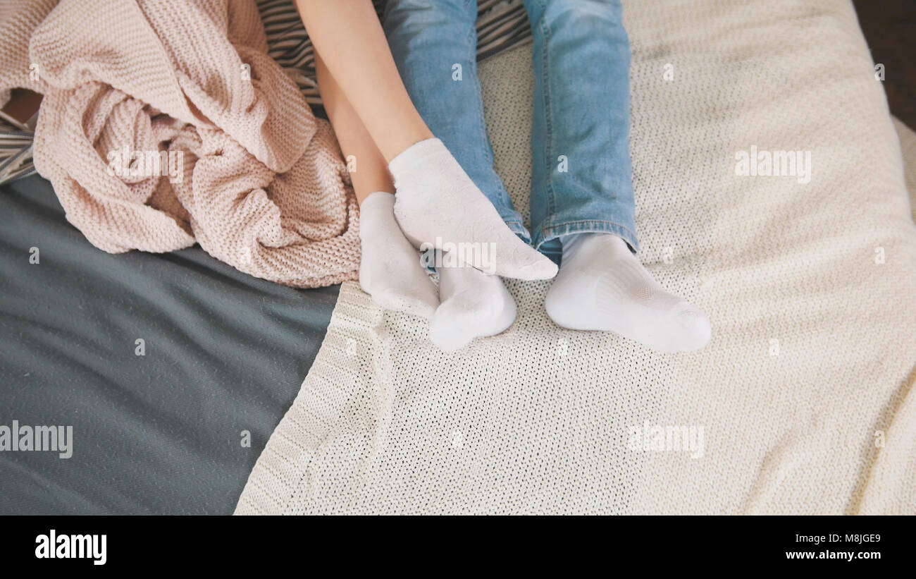 Legs of young attractive couple cuddling and waking up together, family ...