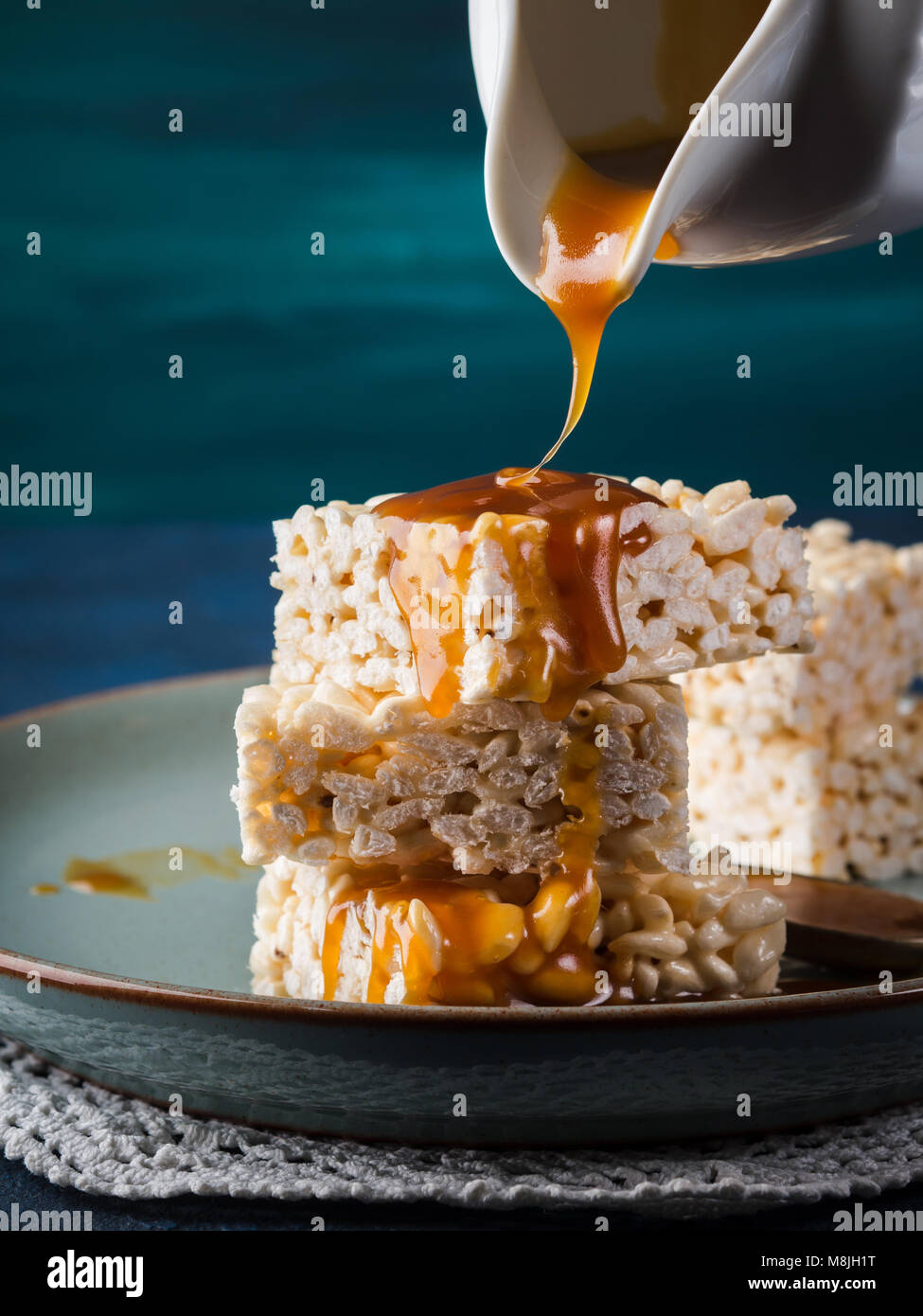 Sweet puffed rice marshmallow bars served with salted caramel Stock ...