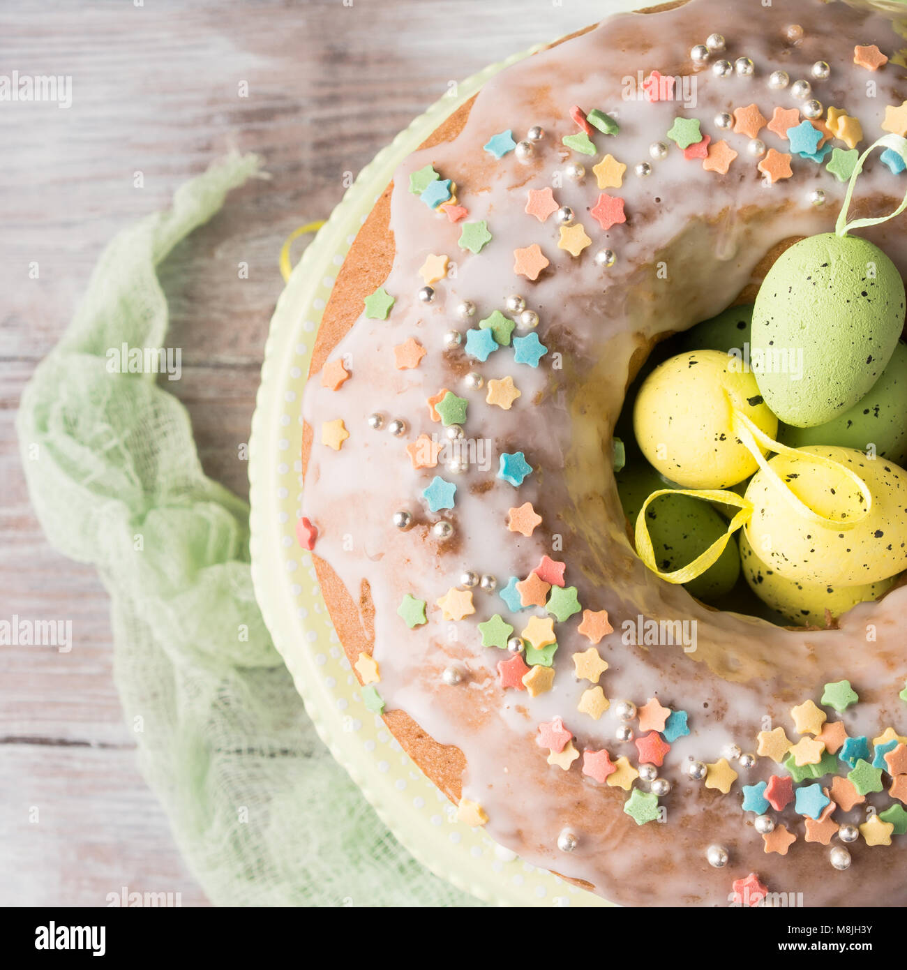 Easter ring cake with decorative festive eggs and sprinkles Stock Photo ...